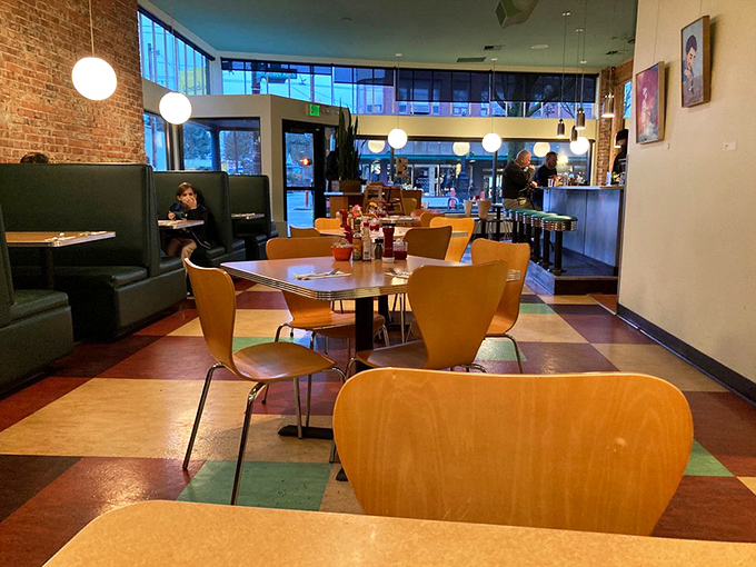 The dining area's mid-century modern vibe makes you feel like you've stepped into the breakfast scene of a Wes Anderson film.