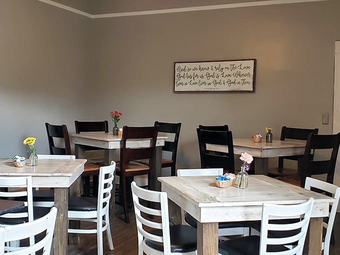 Simple wooden tables and chairs create a distraction-free zone for serious cheesecake contemplation &ndash; no fancy d&eacute;cor competing with the star attraction.