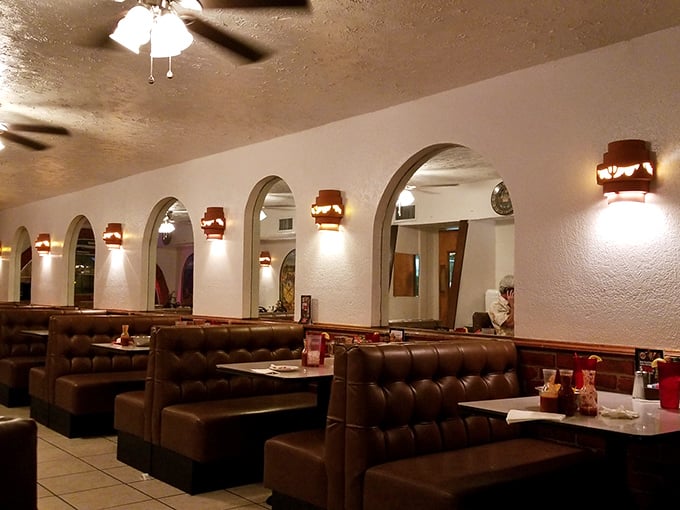 The dining room's arched doorways and warm lighting create the feeling you've been invited to dinner at your most interesting friend's hacienda.