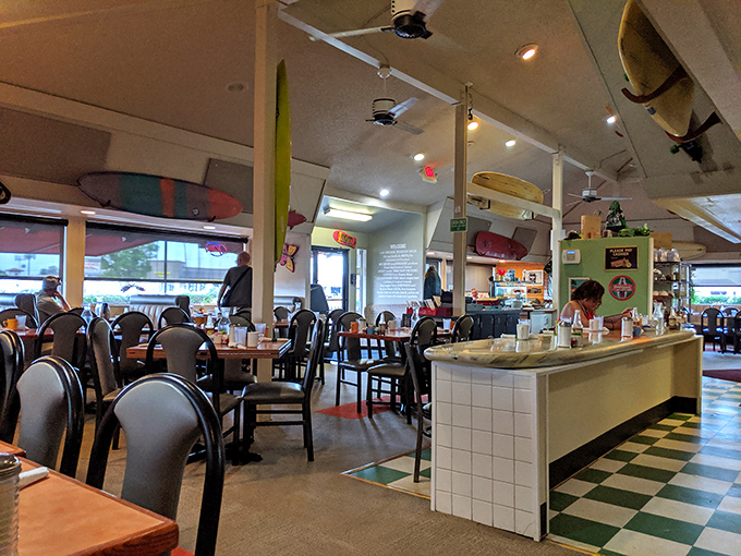 Classic black and white checkered floors meet surfboard decor&mdash;it's like the Fonz opened a Hawaiian breakfast joint.