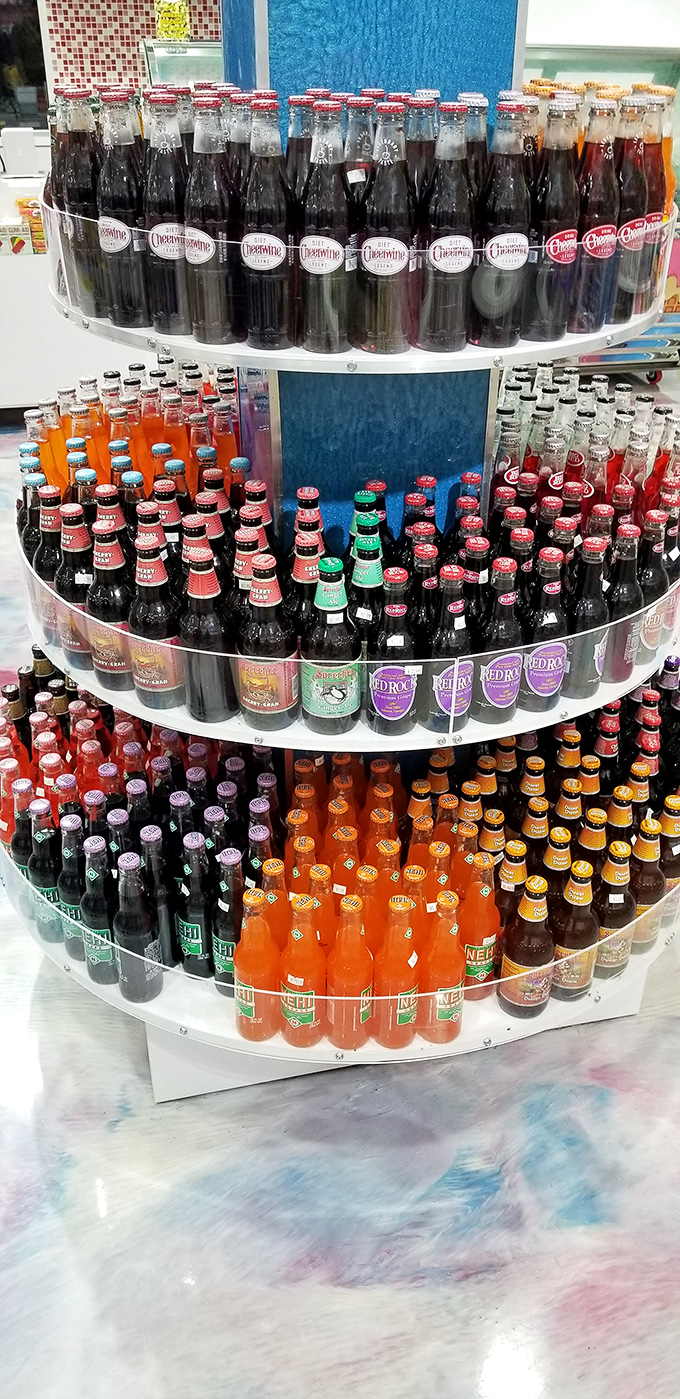 Vintage sodas in glass bottles stand like sugary soldiers, ready to transport you back to simpler times with every fizzy sip.