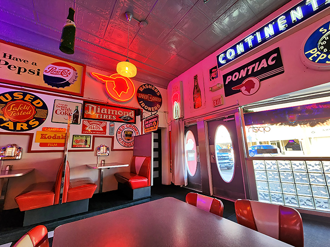 The pink glow from vintage signs transforms this corner into the world's most delicious museum. Even the exit sign looks appetizing.