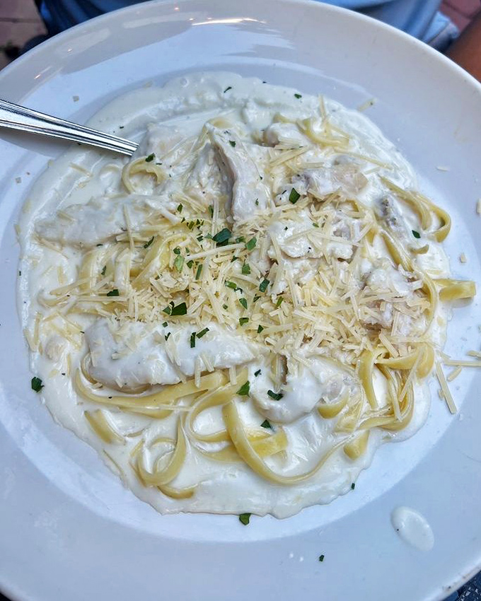This fettuccine Alfredo isn't just creamy—it's the kind of dish that makes you close your eyes and forget your own name for a moment.