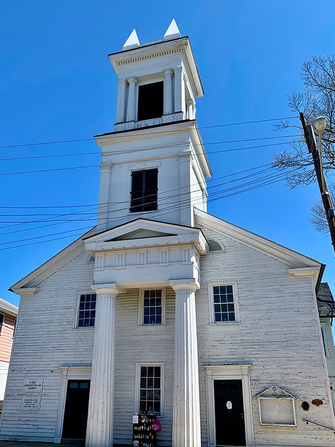 The First Presbyterian Church's steeple reaches skyward like a spiritual exclamation point, its white clapboard simplicity speaking volumes about New England influence in New Jersey.