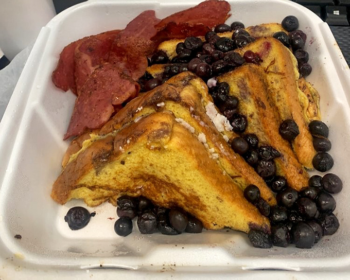 French toast that's had a blueberry makeover, with bacon standing guard to ensure sweet-savory balance.