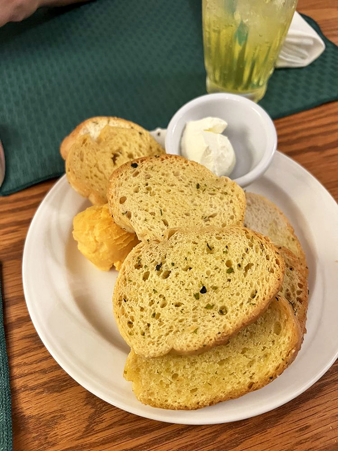 Bread so fresh and golden it makes you reconsider your entire relationship with carbohydrates. Diet plans come here to die gloriously.
