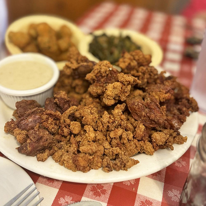 Crispy fried chicken livers, hush puppies, and hash brown casserole&mdash;the holy trinity of Southern indulgence. Diets come to die on plates like this.