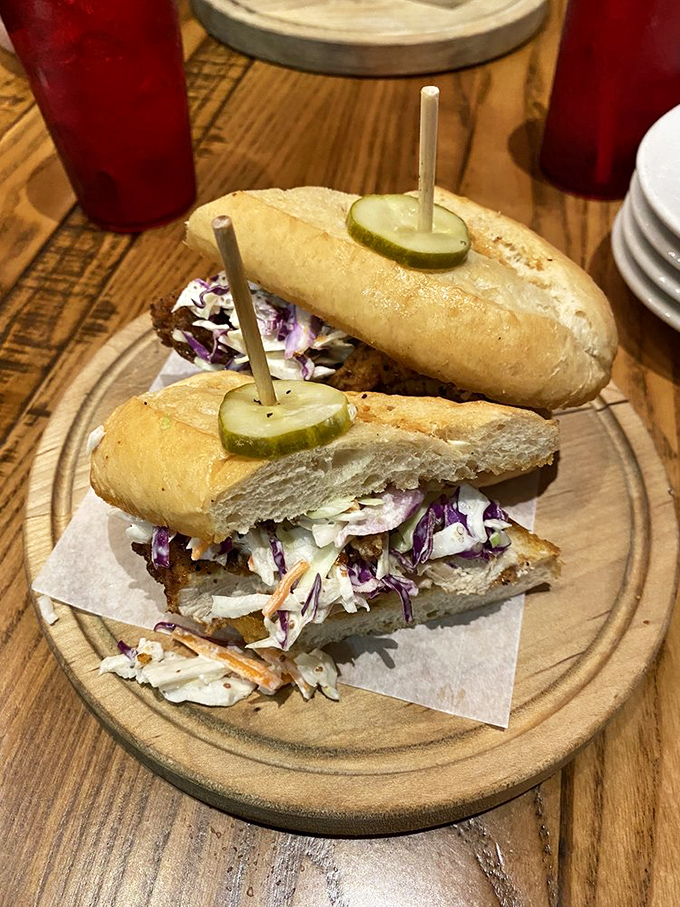 A fried chicken sandwich that makes fast food versions hide in shame. Crispy chicken, tangy slaw, and those house pickles create sandwich perfection.