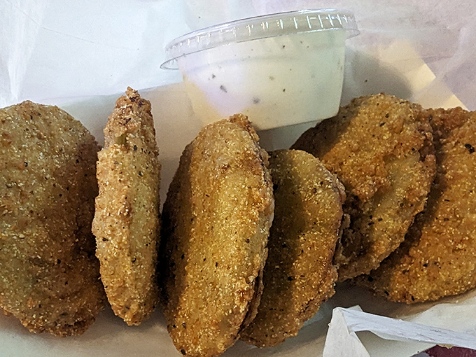 Fried green tomatoes with ranch dipping sauce&mdash;tangy, crispy discs of joy that make vegetables feel like an indulgence.