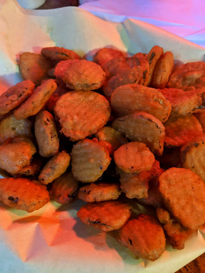 These golden pickle chips have been transformed from humble cucumber slices into crispy discs of tangy satisfaction.