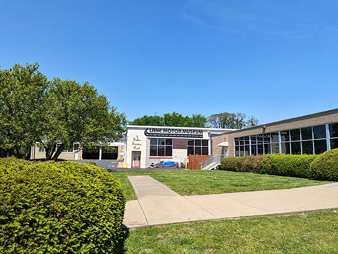 Blue skies frame this automotive sanctuary where gearheads and the merely curious alike find mechanical nirvana among the well-manicured grounds.
