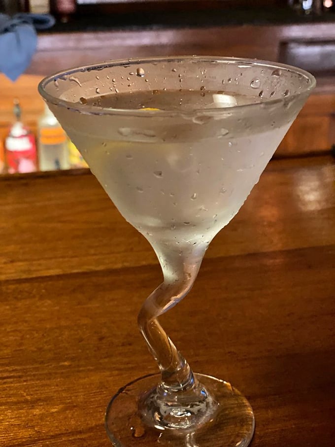 The martini glass's twisted stem says what we're all thinking: one sip and your evening takes a delightful turn toward happiness.
