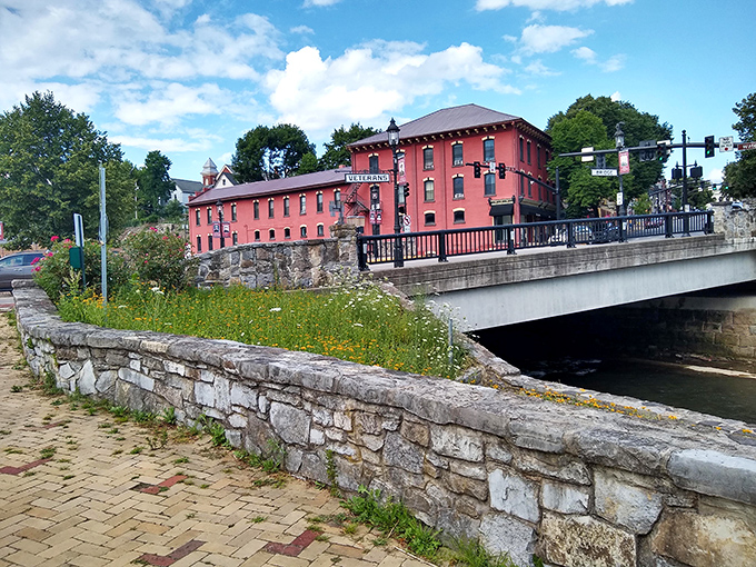 The red brick waterfront buildings reflect in Spring Creek like a double feature at a discount matinee—two beautiful views for the price of none.