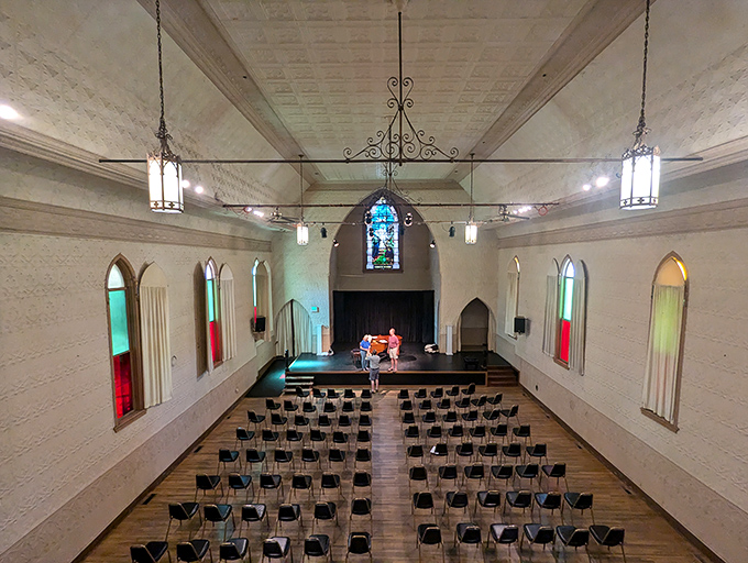 Simple white walls and stained glass windows create an intimate venue where acoustics are so perfect you can hear musicians breathe between notes.