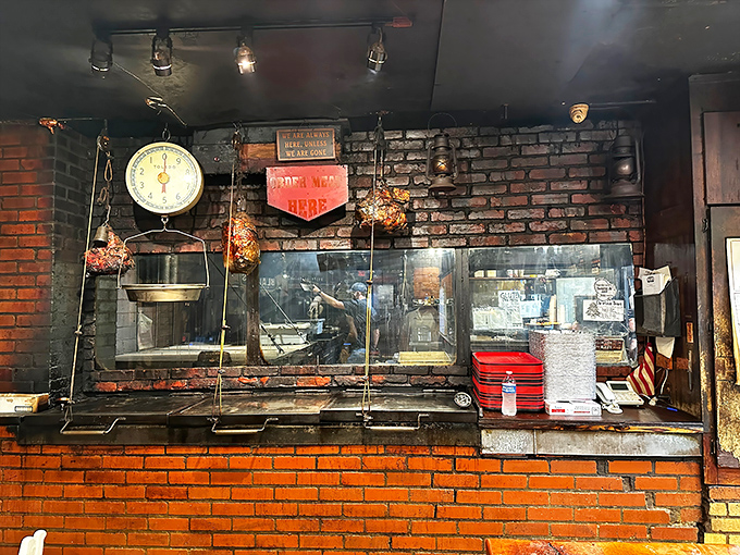 Behind this brick wall, magic happens. The smoke-stained window offers glimpses of a ritual that's part science, part art, all delicious.