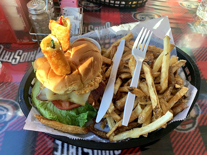 A burger so impressive it deserves its own tiny flag. Those hand-cut fries aren't just a side&mdash;they're co-stars in this meal.
