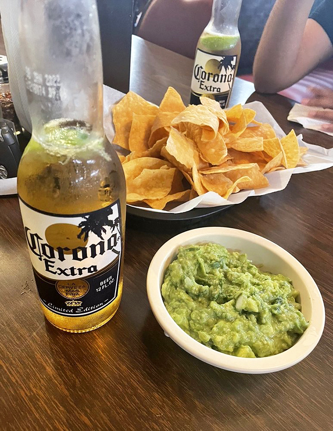 The holy trinity of Mexican dining: cold Corona, fresh guacamole, and house-made chips. Some combinations are simply meant to be.