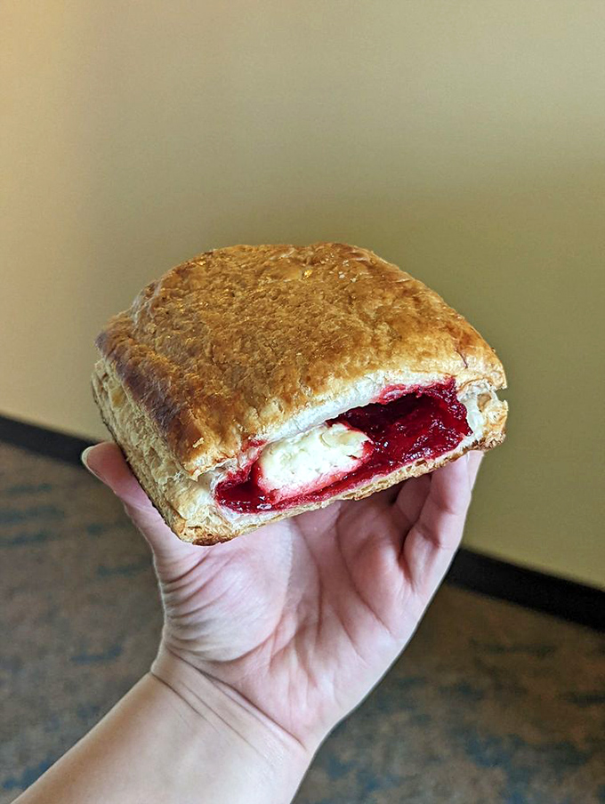 This guava and cheese pastelito reveals its treasure like a culinary sunset &ndash; layers of pastry giving way to that perfect sweet-tangy filling that haunts dreams.