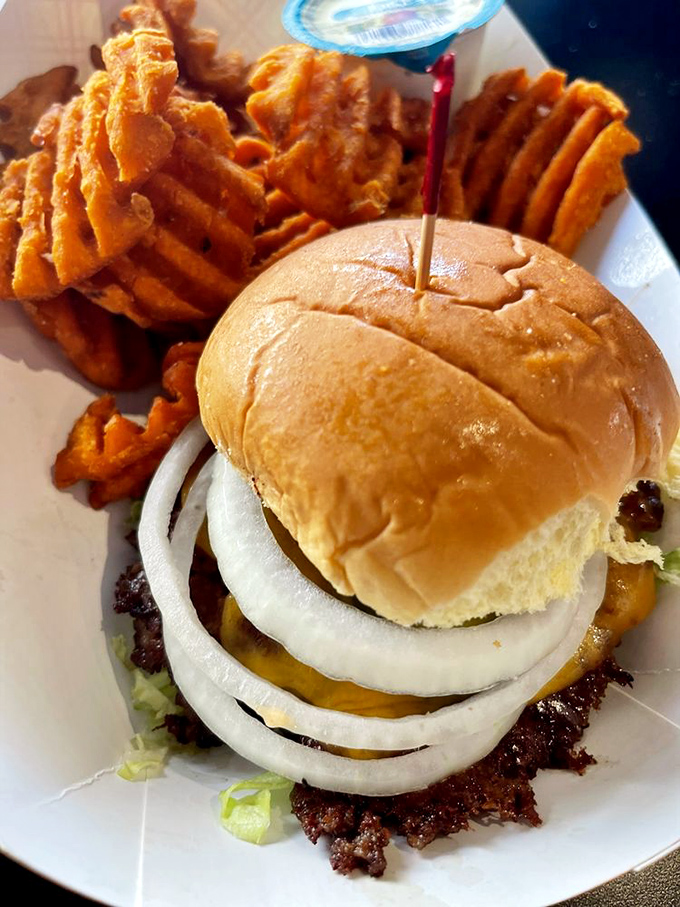 Three patties stacked like a meaty skyscraper with cheese mortar between each floor. This burger doesn't just satisfy hunger&mdash;it obliterates it into next week.