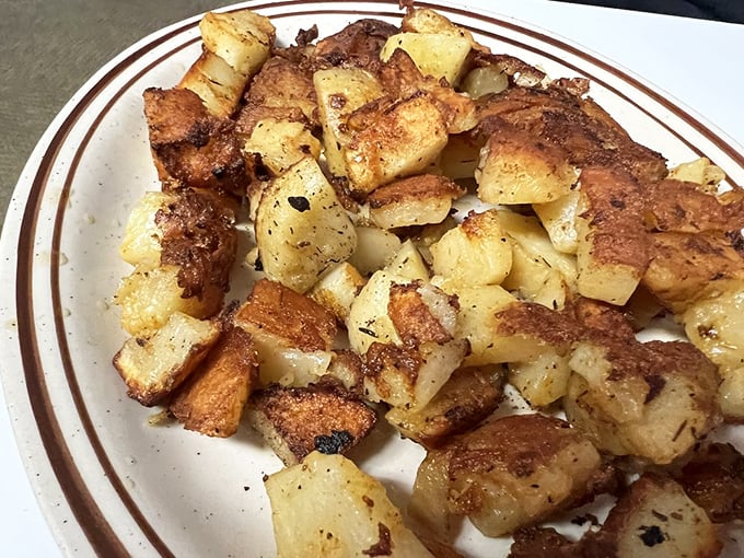 Home fries so perfectly seasoned and crispy, they might make you forget about the main course. Almost.