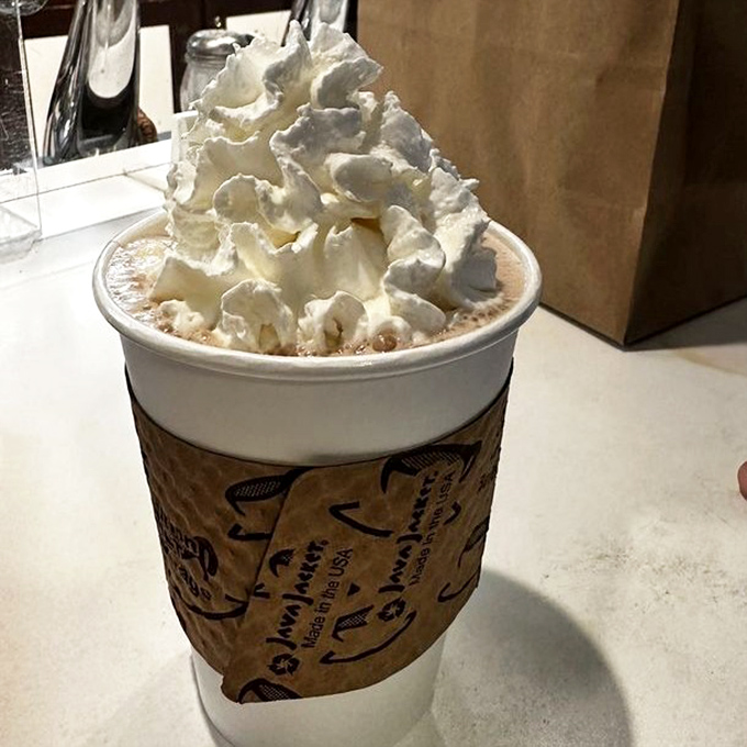 Hot chocolate that wears its whipped cream like a fluffy crown. Royalty in a cup, no noble bloodline required.