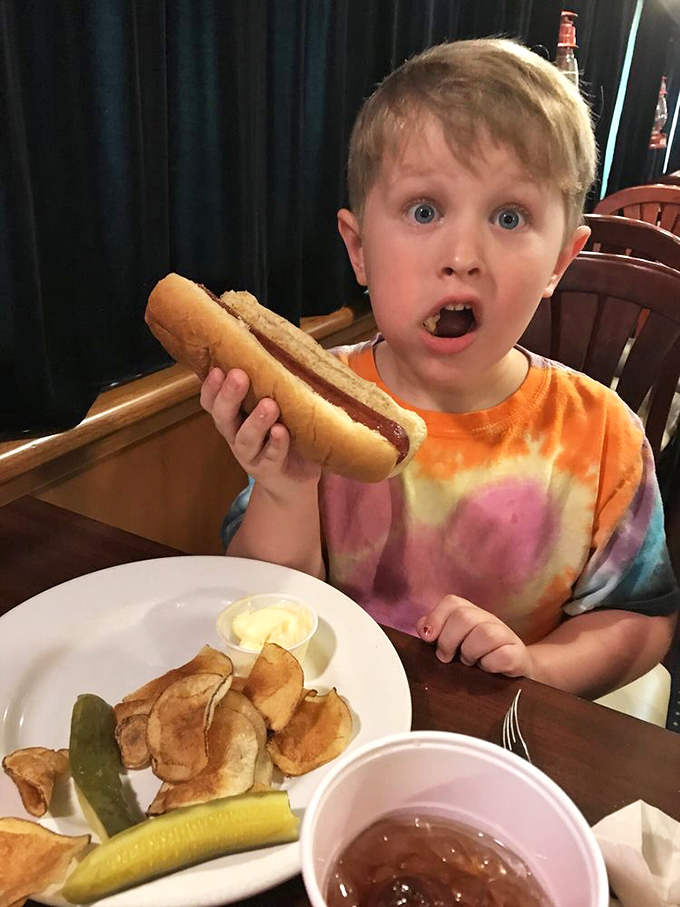 The pure joy of childhood captured in one image! This hot dog has clearly derailed any chance of eating sensibly&mdash;and nobody's complaining.