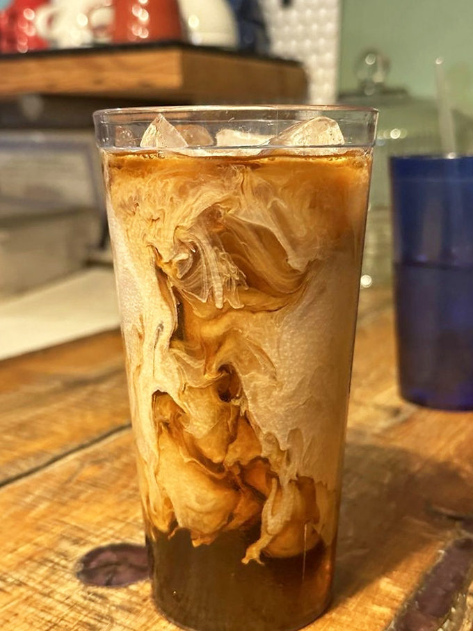 Iced coffee that swirls like a caffeinated lava lamp. The cream creates hypnotic patterns that might distract you from your morning caffeine mission.