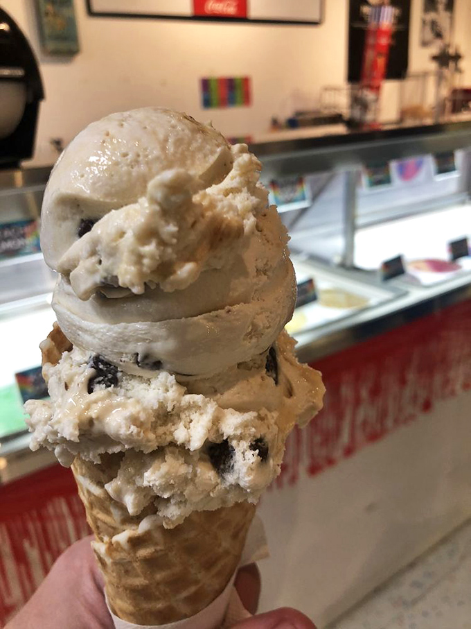 This towering ice cream cone defies both gravity and moderation. Notice how there's still room for one more scoop? That's optimism in dessert form.