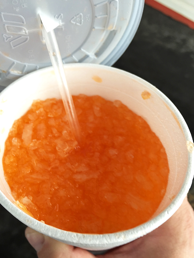 That vibrant orange drink isn't just refreshing&mdash;it's liquid sunshine in a cup, the perfect companion for a hot Missouri day.