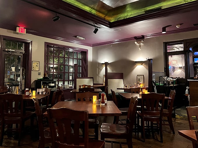 Evening light transforms the dining room into a sanctuary where conversations flow as smoothly as the drinks from the bar.