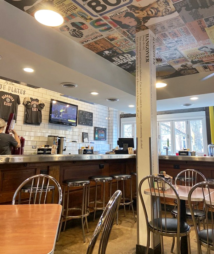 Newspaper collages on the ceiling prove you can literally be surrounded by good news while eating breakfast. Diner chic meets college-town creativity.