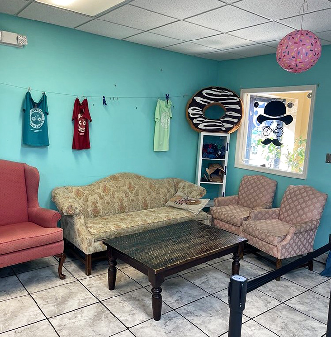 The lounge area feels like your coolest friend's living room, complete with vintage furniture and a donut-shaped decoration watching over all.