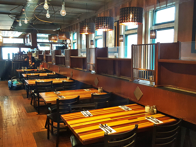 Wooden tables bathed in natural light create the perfect stage for pasta performances that deserve standing ovations.