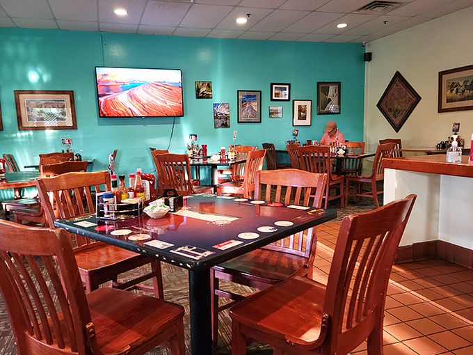 Wooden chairs, turquoise walls, and Southwestern art create the perfect backdrop for the serious business of comfort food consumption.