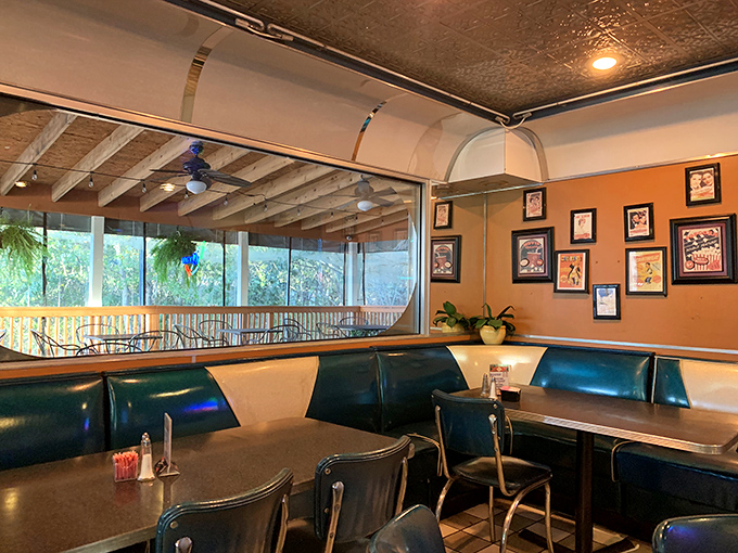 Booth seating with a view of the greenery outside&mdash;casual comfort that invites you to linger over one more margarita.