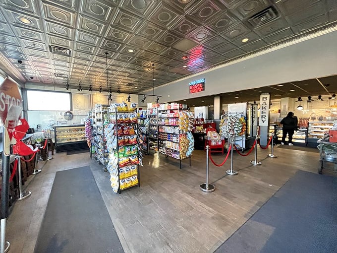 The interior feels like stepping into a time capsule of deliciousness. Snack racks and display cases promise treats for now and provisions for later.
