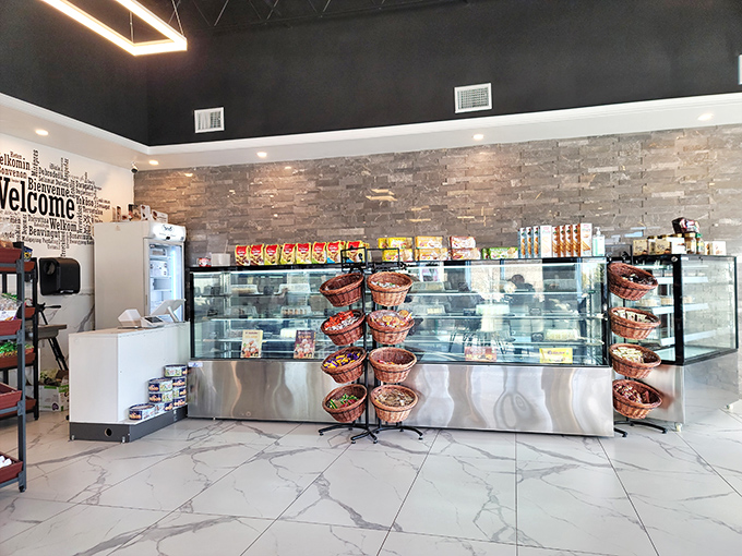 Display cases that belong in the Louvre, showcasing edible masterpieces behind glass that's probably been nose-printed by eager customers.