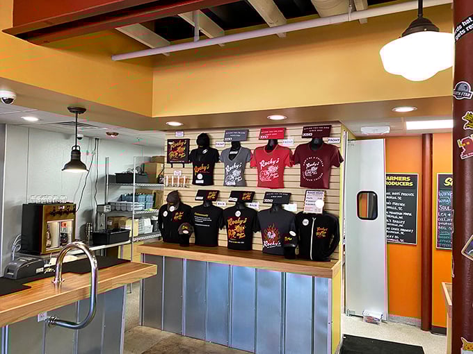 Merchandise wall says, "Yes, you can take the experience home," but sadly, not the actual chicken. T-shirts: the next best thing to leftovers.