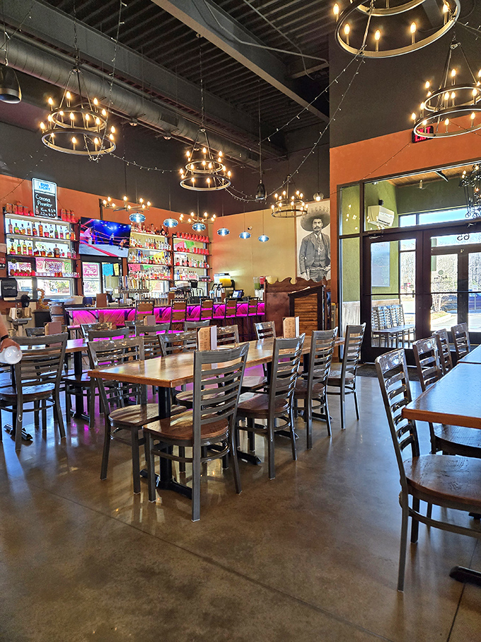 The dining room balances festivity with comfort – string lights overhead, warm wood tables below, and the promise of memorable meals everywhere in between.