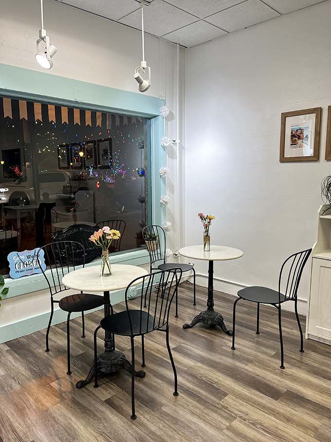 Bistro tables and wire-backed chairs create an intimate setting where you could easily lose track of time over coffee and conversation.