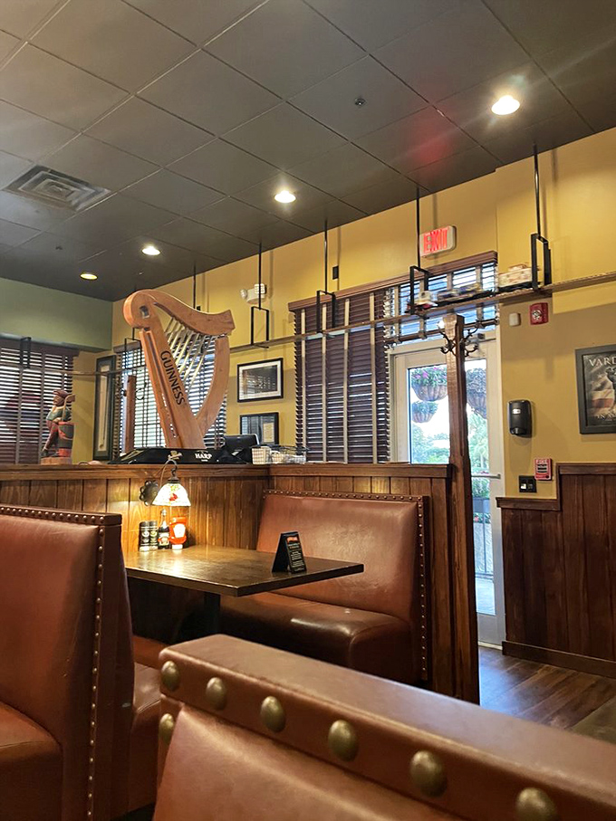 Pub aesthetics that transport you straight to London. Note the decorative harp on display&mdash;a nod to Ireland's contribution to British pub culture.