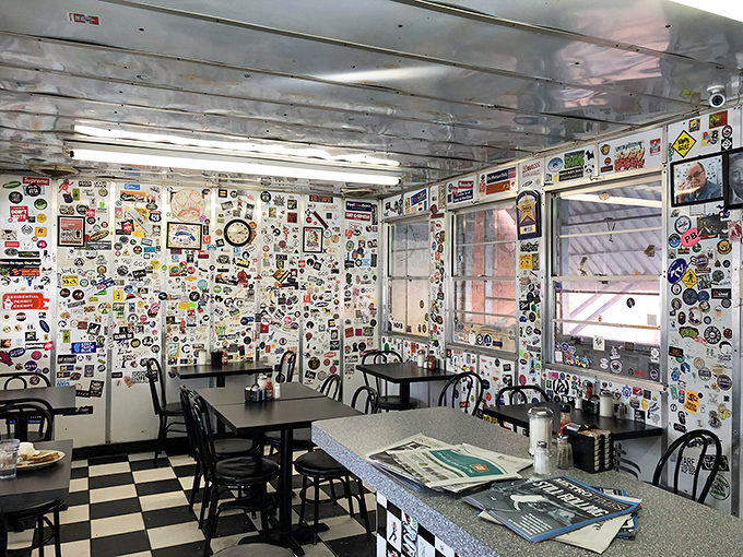 The diner's interior is part time machine, part community bulletin board. Every sticker represents someone who thought, "I was here, and it mattered."