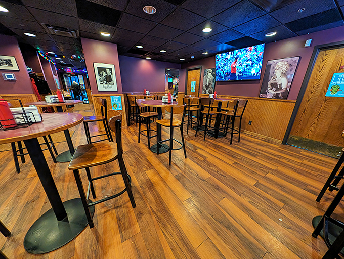 The warm wood tones and high-top seating create that perfect "neighborhood joint" vibe where strangers become friends over shared Juicy Lucy enthusiasm.
