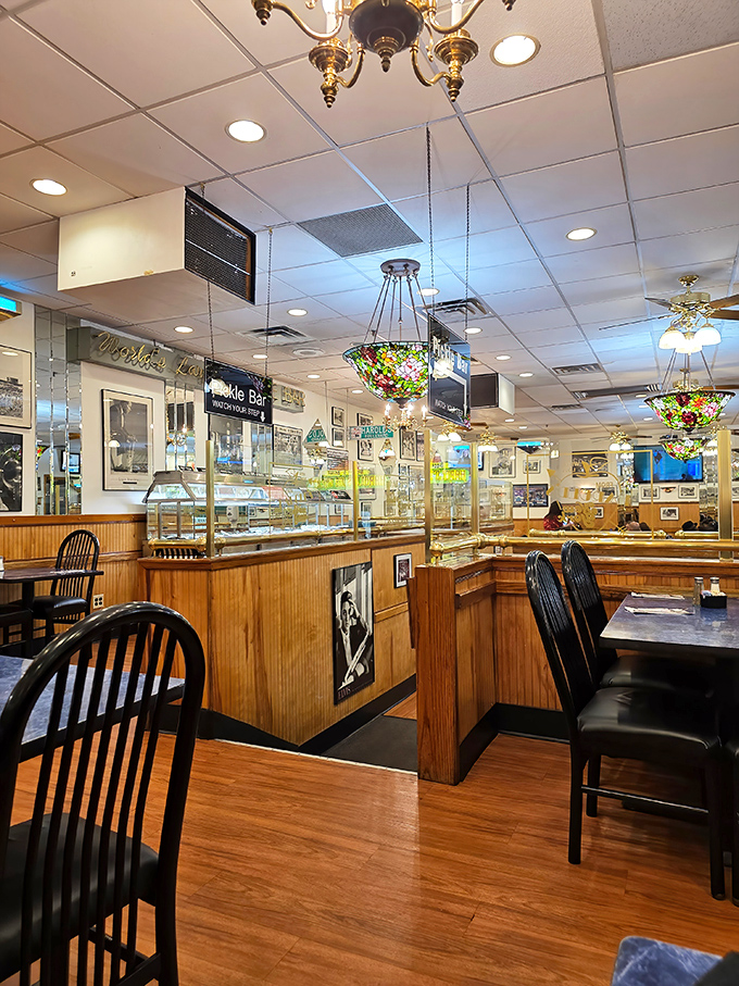 The stained glass ceiling fixtures and wood paneling create that perfect "your Jewish grandmother's dining room, but bigger" atmosphere that every great deli needs.