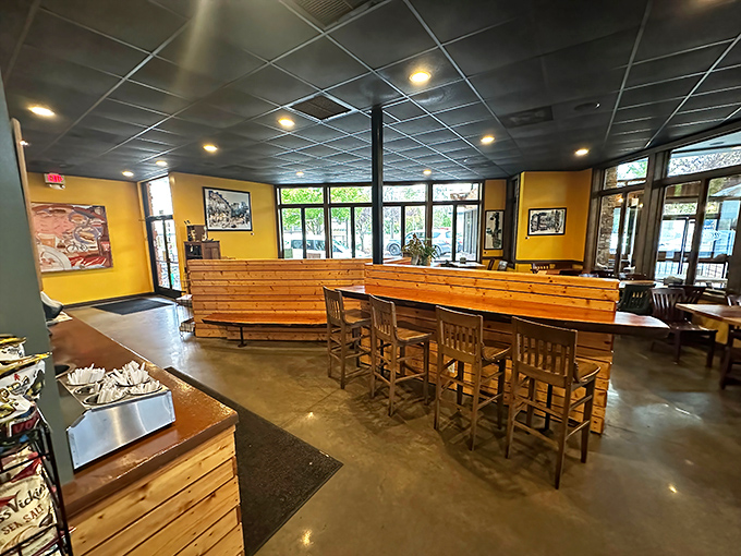 The interior strikes that perfect balance between modern and rustic. Those wooden booths practically invite you to settle in for sandwich bliss.