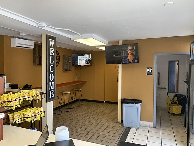 The "WELCOME" sign isn't just decoration&mdash;it's a promise kept with every sandwich served in this humble, functional space.