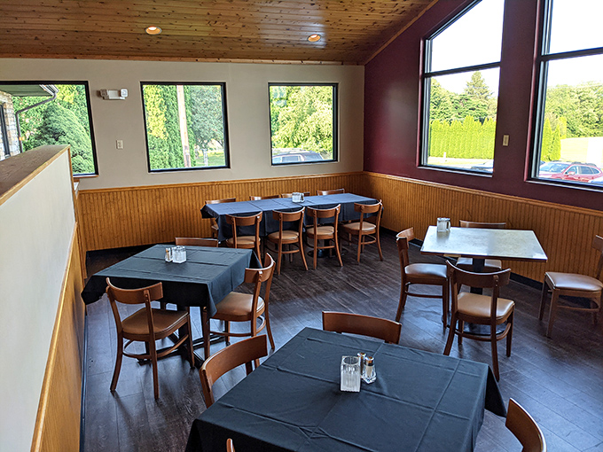 The dining area's wood-paneled charm and abundant natural light create that rare space where both grandparents and hipsters feel equally at home.
