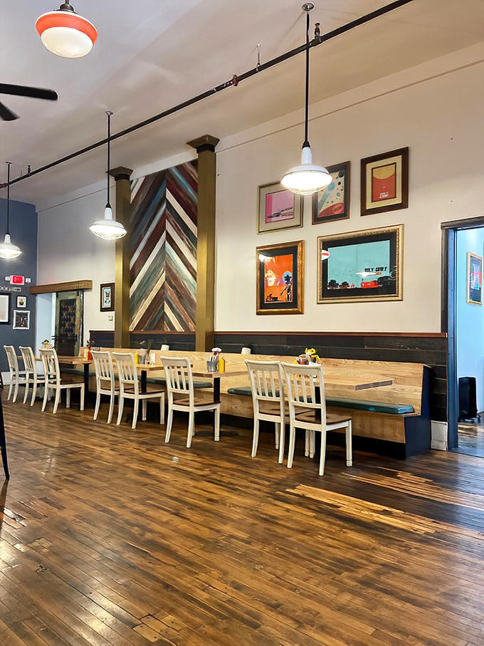 Chevron-patterned wood columns and gallery walls create a space that feels both trendy and timeless. Comfort with a side of cool.