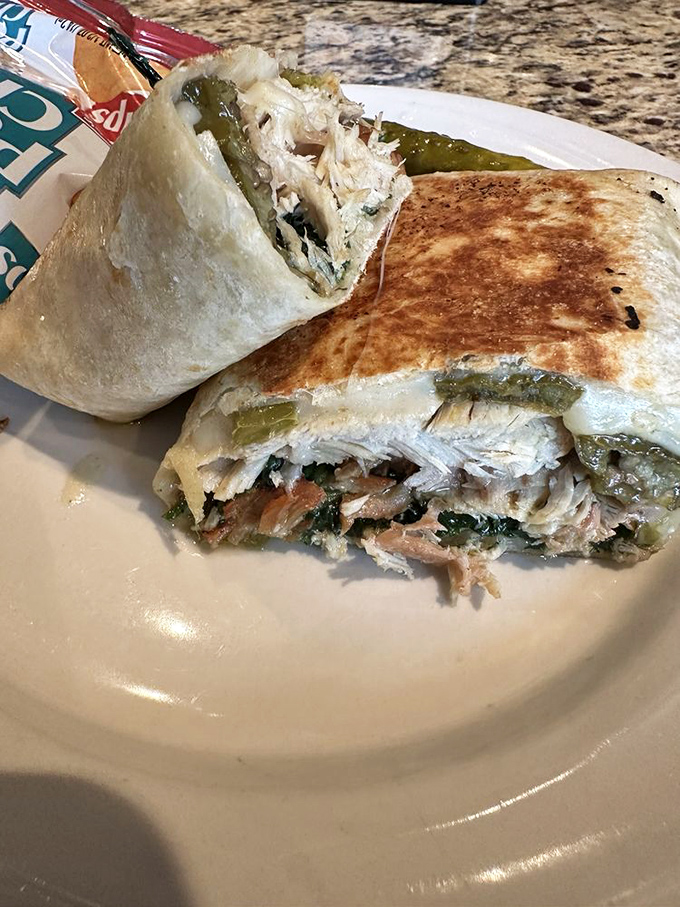 A wrap that defies the laws of structural engineering&mdash;somehow containing all that delicious filling while remaining perfectly grilled. Sandwich architecture at its finest.