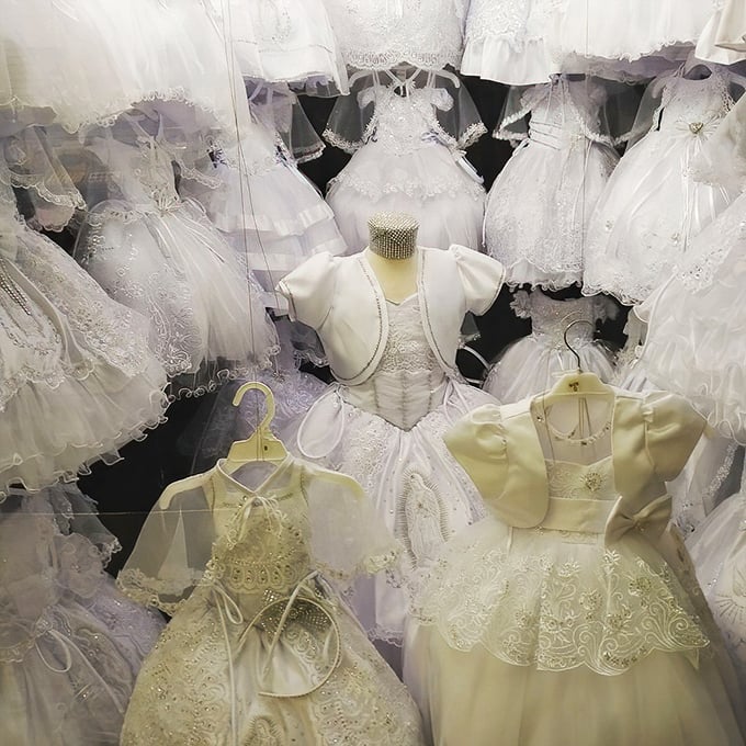 Tiny white dresses fit for princesses-in-training hang like clouds, waiting to transform ordinary days into unforgettable celebrations.